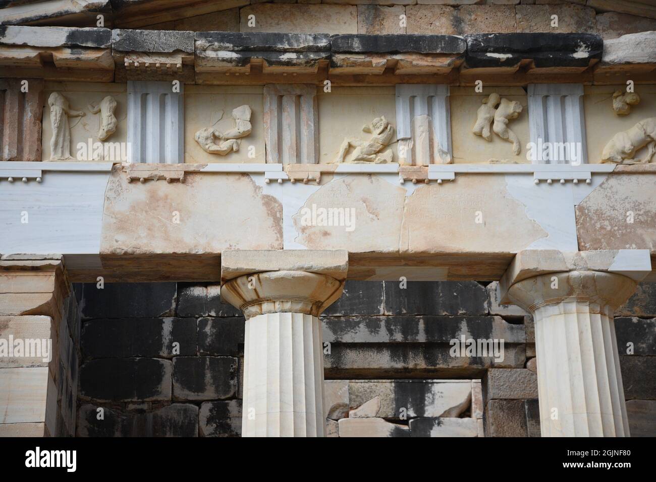 Marble sculpted triglyph, metope and columns of the Doric order ...