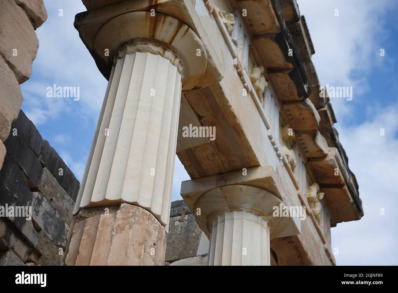 Marble sculpted triglyph, metope and columns of the Doric order ...