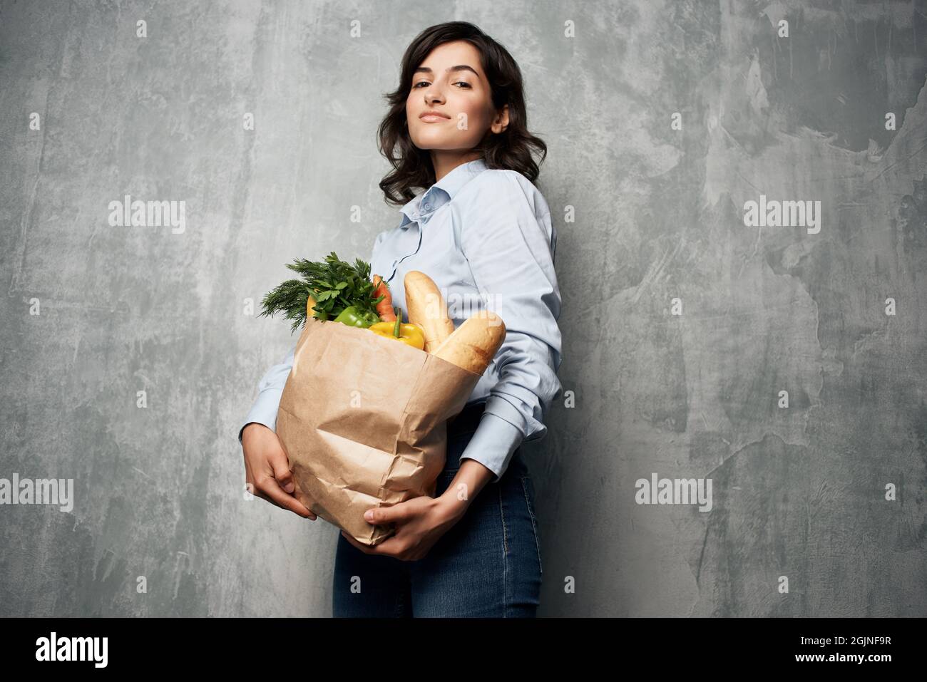 woman with a package of groceries delivery shopping service Stock Photo ...