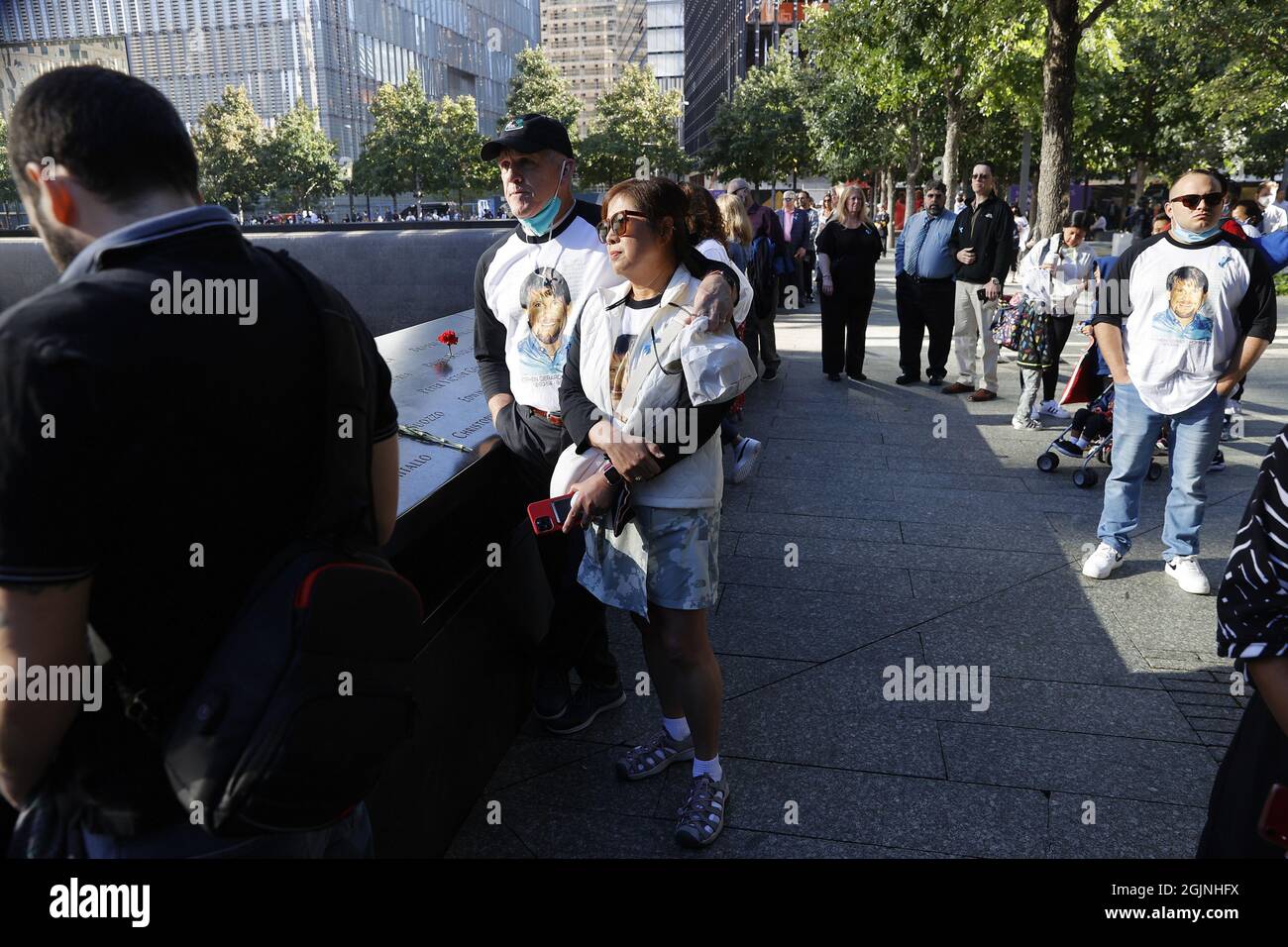 New York City, USA. 11th Sep, 2021. People observe a moment of silence ...