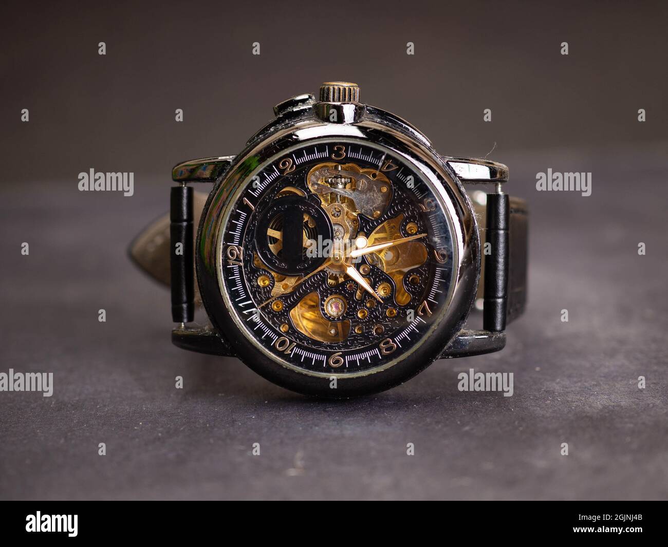 Close up shoot of black skeleton automatic watch. Captured on a dark ...