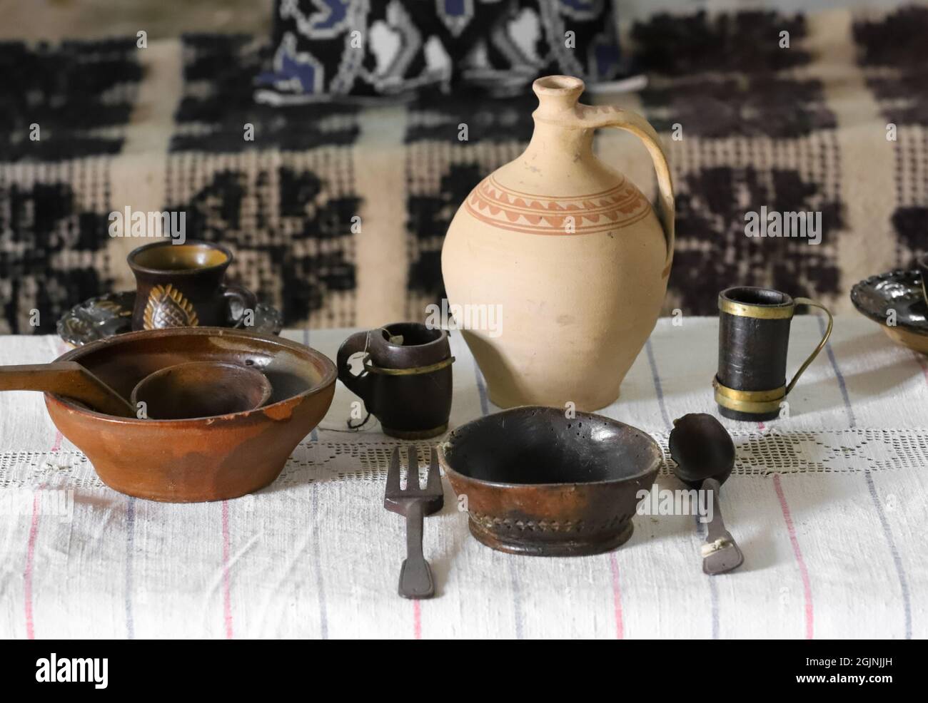 HUNEDOARA, ROMANIA - Aug 06, 2021: a table with peasant pots and plates ...