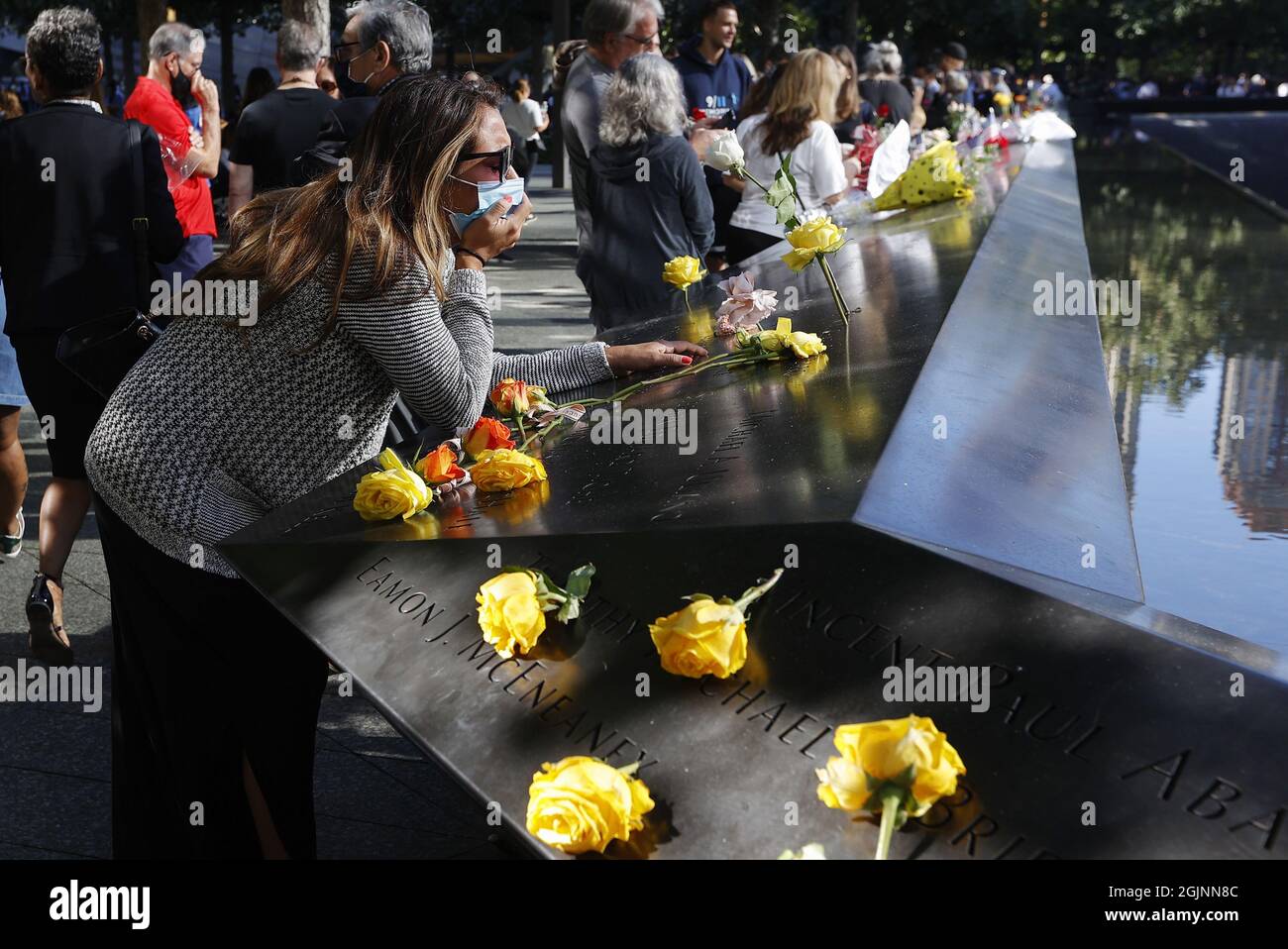 New York City, USA. 11th Sep, 2021. People mourn at the 9/11 Memorial ...