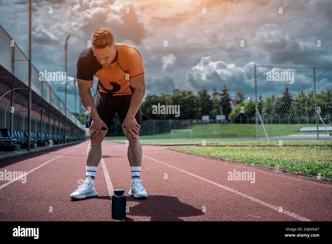 tired runner male or bodybuilder and protein powder or sport supplement ...