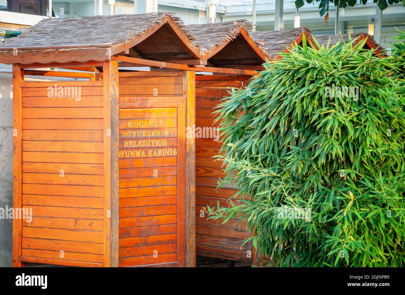 KARAMURSEL, TURKEY. AUGUST 29, 2021 Wooden changing rooms next to the ...