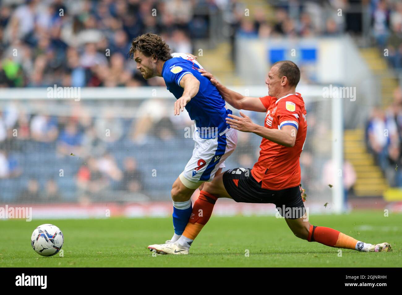 Sam Gallagher #9 of Blackburn Rovers is fouled by Kal Naismith #4 of ...
