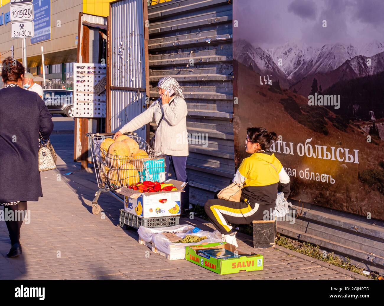 Street vendors selling melons on street corner, Nur-Sultan, Astana ...