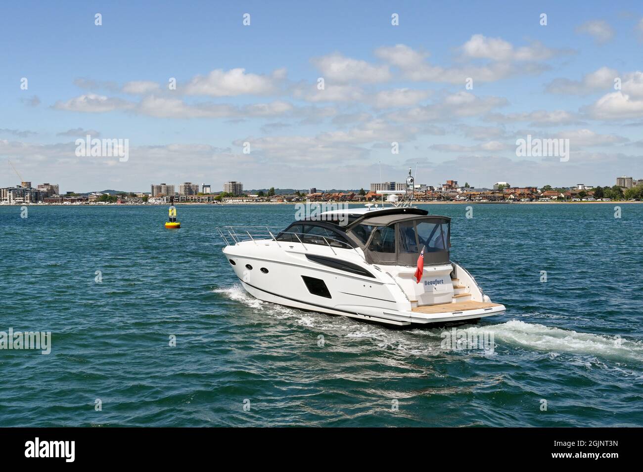 Poole, Dorset, England - June 2021: Motor boat cruising in the calm ...