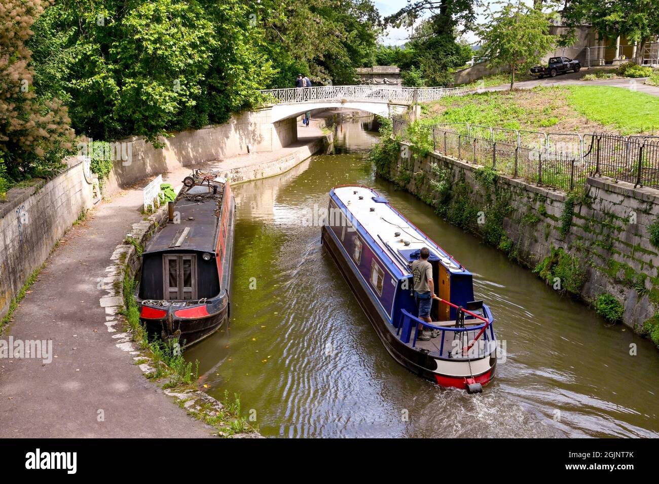 Bath, England - August 2021: Person steering a narrow boat along the ...