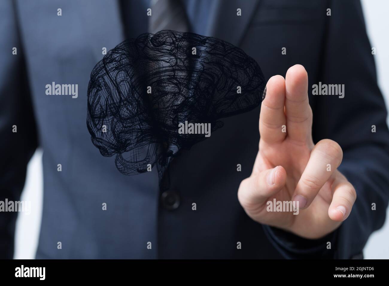 Closeup of a man pointing into 3D rendered human brain anatomical model ...