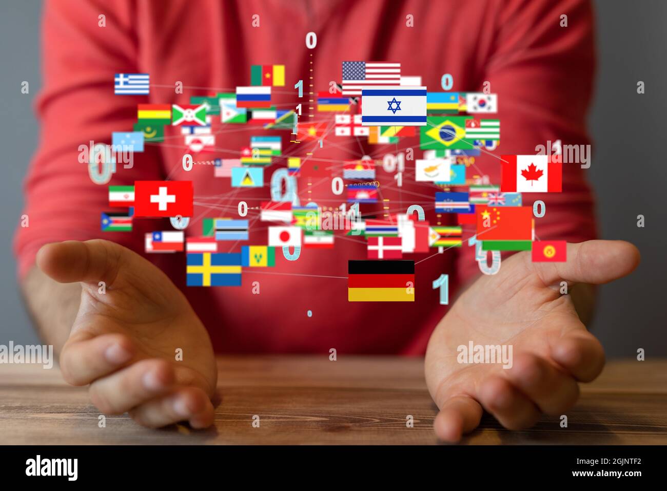 Closeup shot of digital countries flags above a table surface between ...