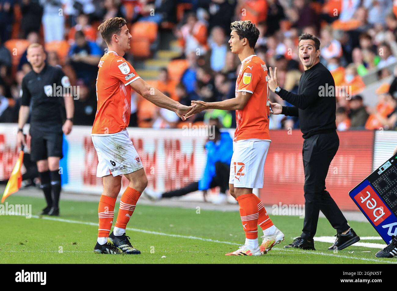 Ryan Wintle (8) Of Blackpool makes way for Kenny Dougall #12 of ...