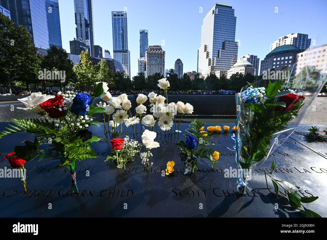 Flowers placed on the memorial at a ceremony at Ground Zero held in ...