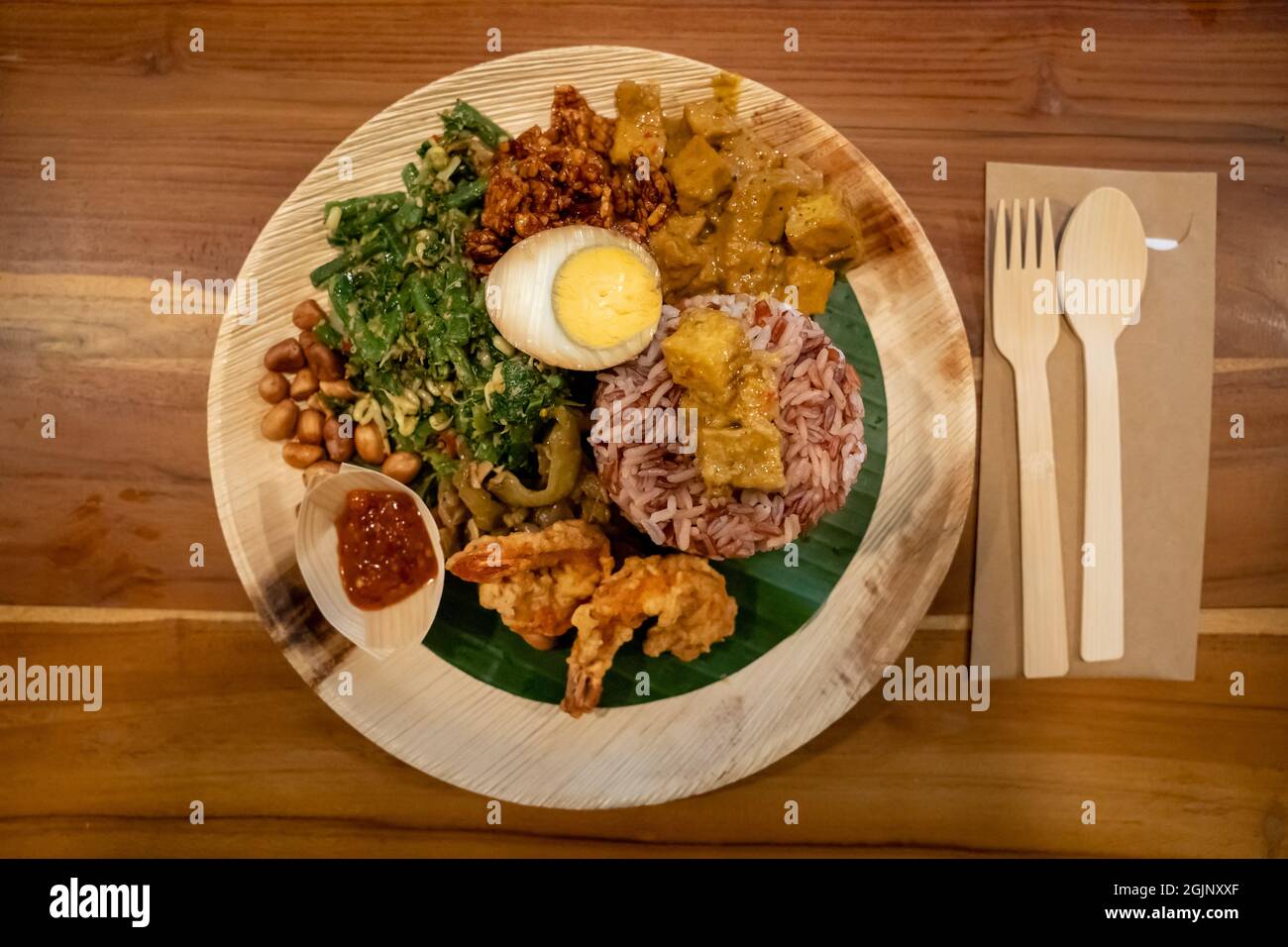 A plate of Balinese food served on a bamboo plate, horizontal Stock ...