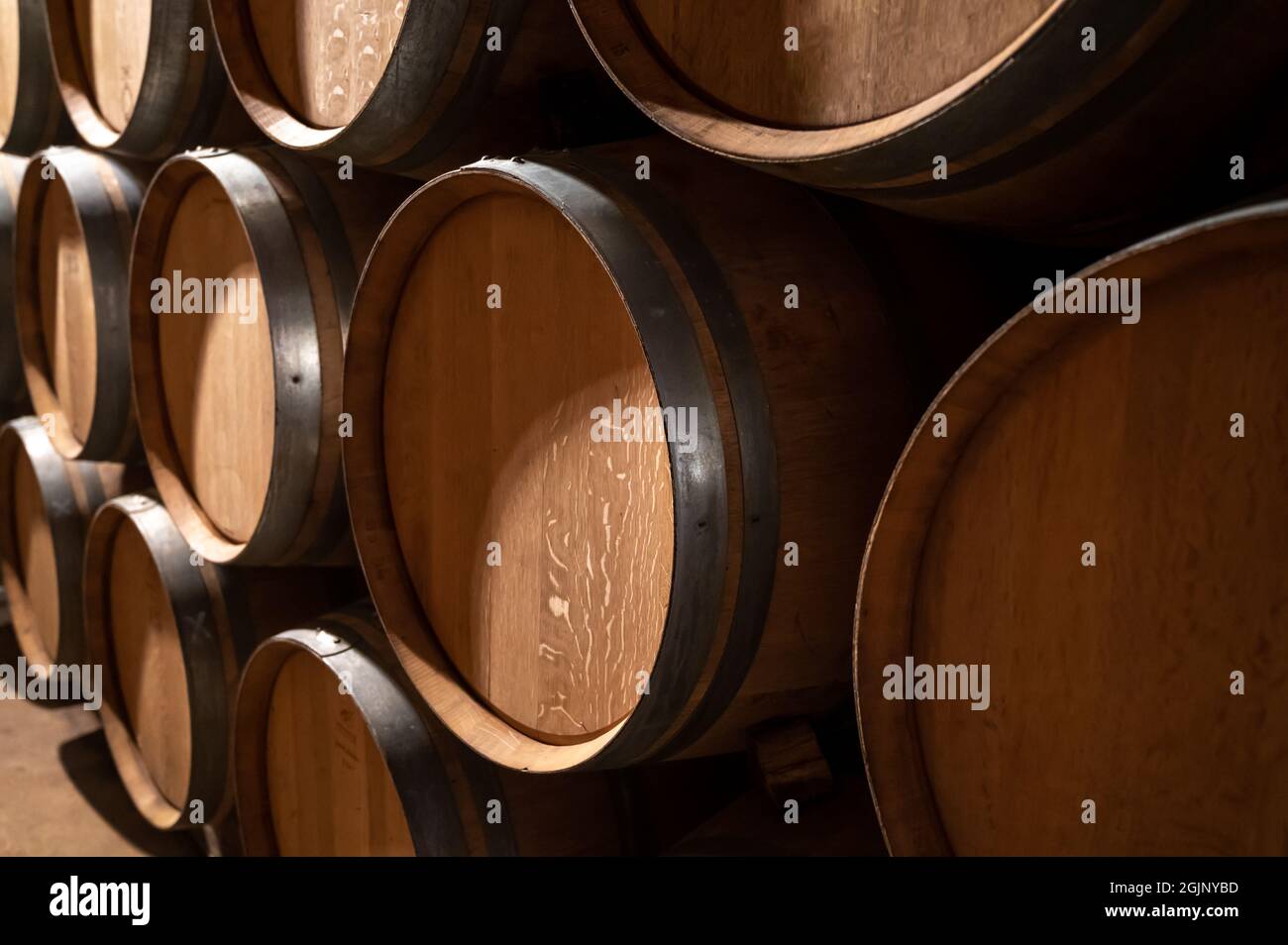 Keeping for years of dry red wine in new oak barrels in caves in ...