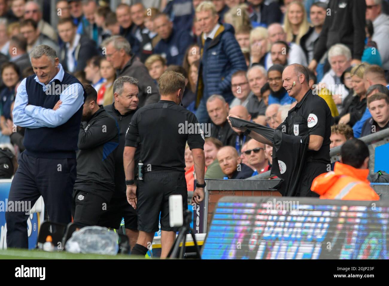 Fourth official Andy Haines prepares for refereeing duties after match ...