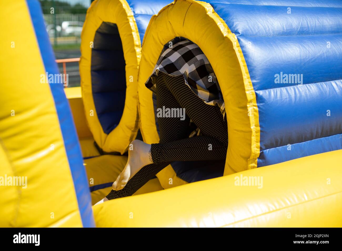 Children climb an inflatable slide. Inflatable obstacle course for fun ...