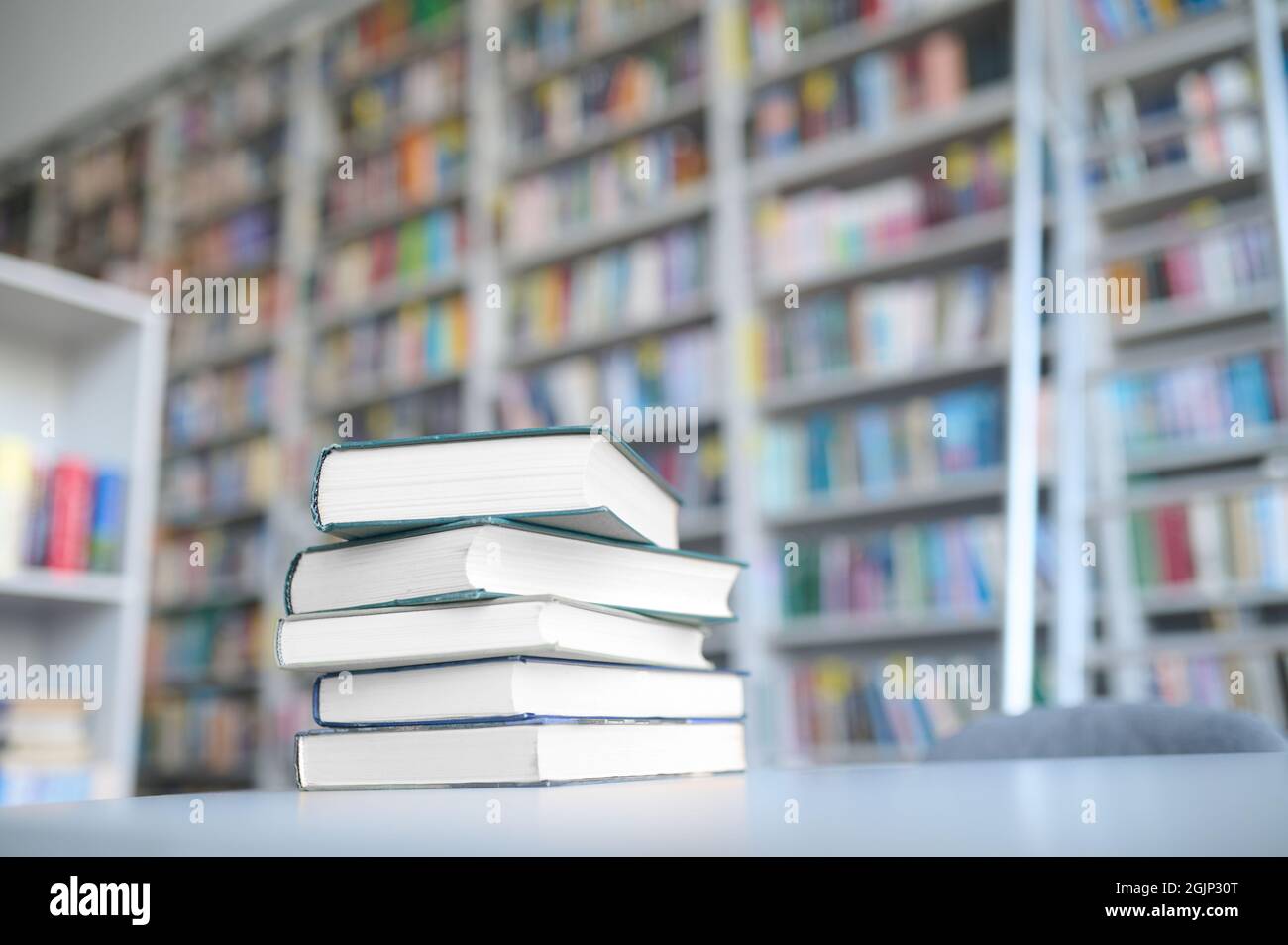 Stack of old textbooks lying on the table Stock Photo - Alamy