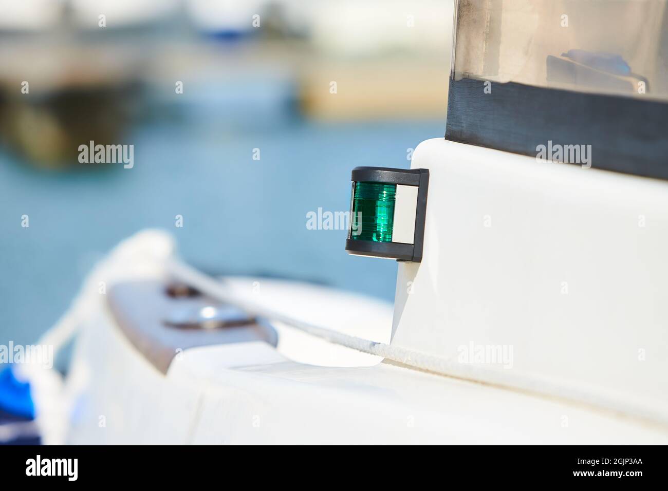 Navigation green lights of a sailboat in a marina Stock Photo - Alamy