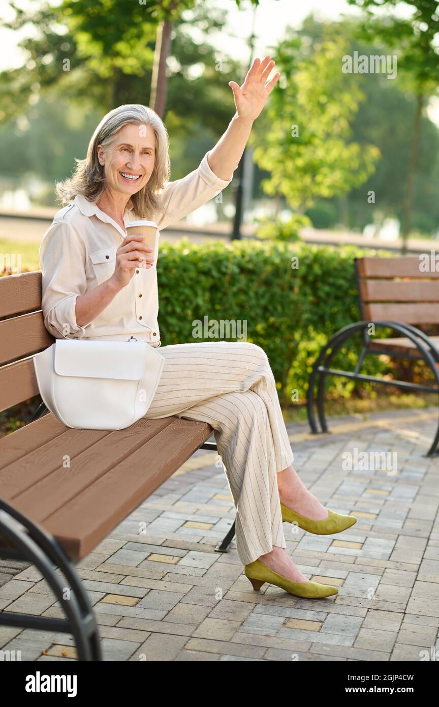 One person raising hand hi-res stock photography and images - Alamy