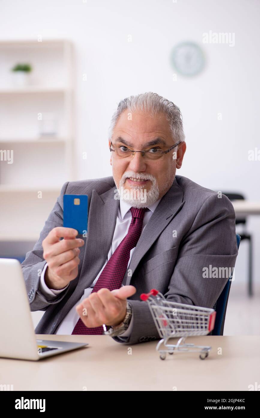 Young employee in e-commerce concept Stock Photo - Alamy