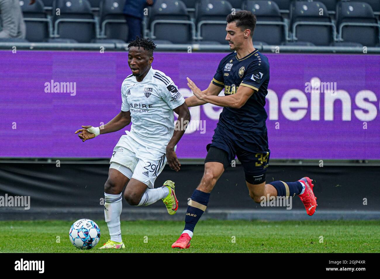 EUPEN, BELGIUM - SEPTEMBER 11: Isaac Nuhu of KAS Eupen, Jelle Bataille ...