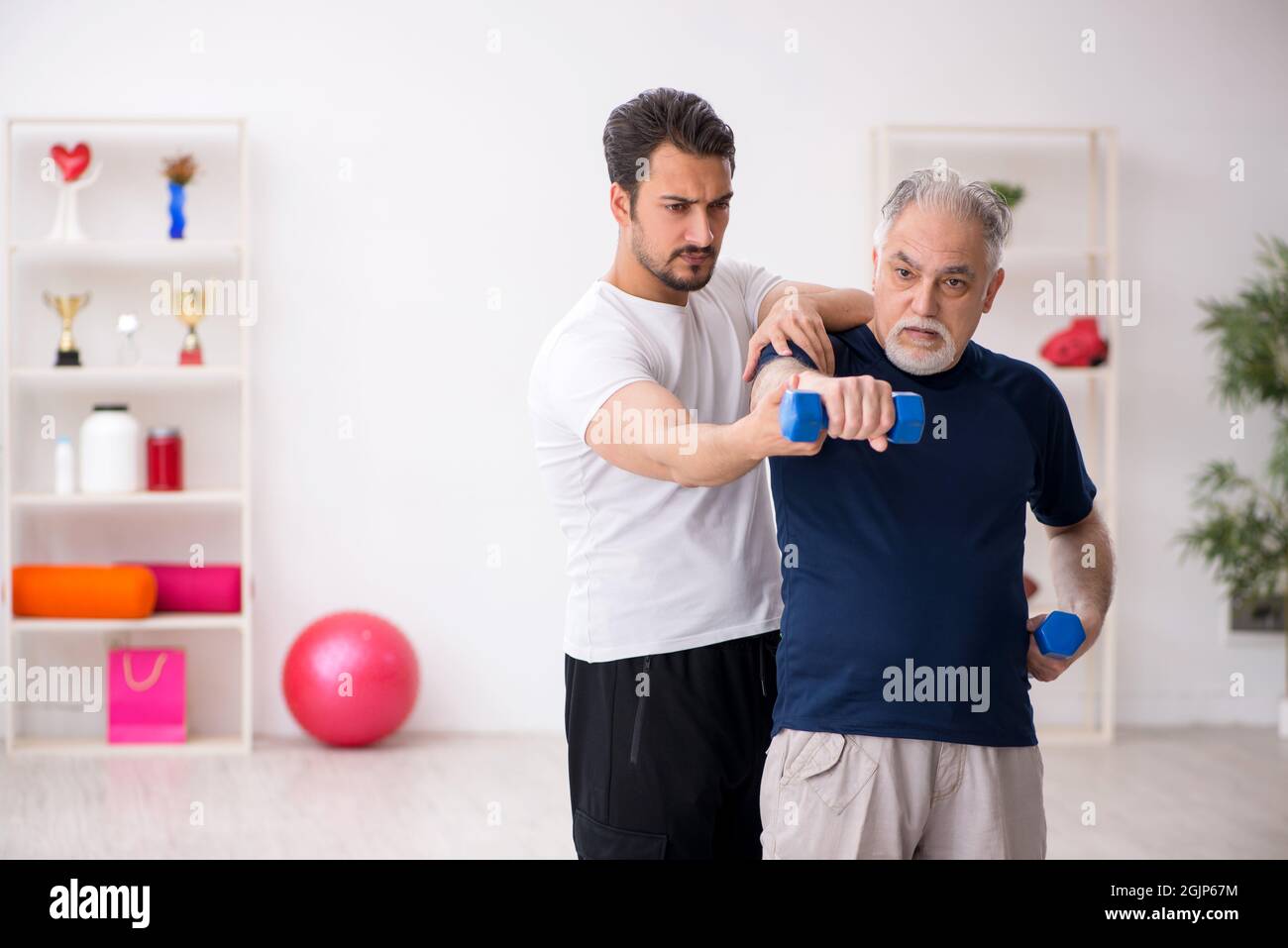 Fitness instructor showing stretching exercises hi-res stock ...