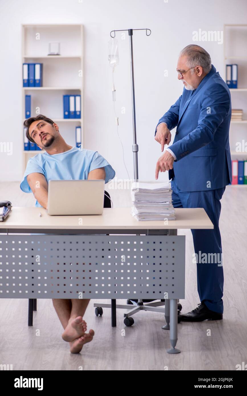 Young employee feeling bad at workplace Stock Photo - Alamy