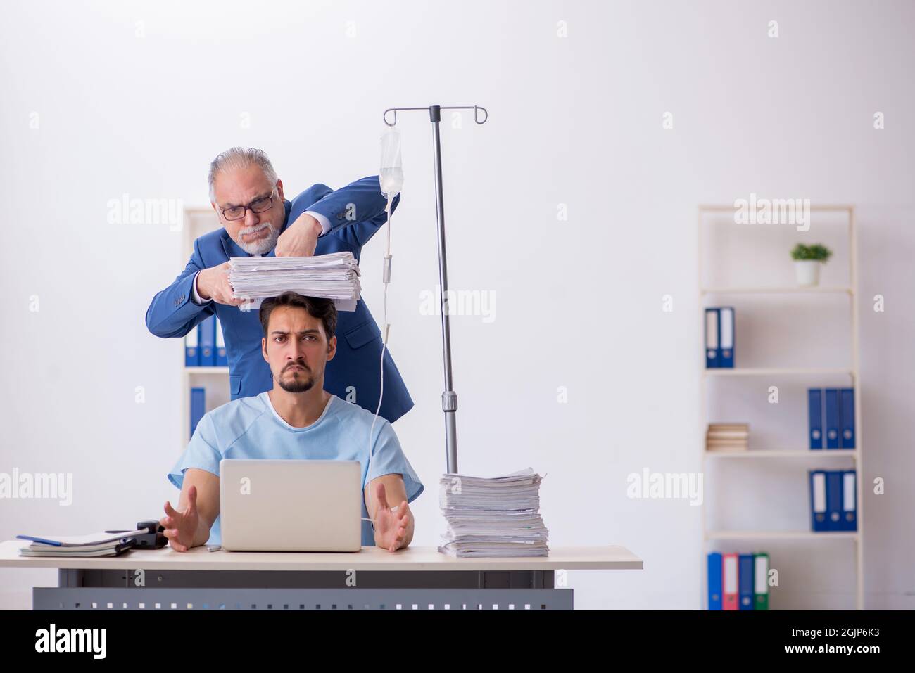Young employee feeling bad at workplace Stock Photo - Alamy