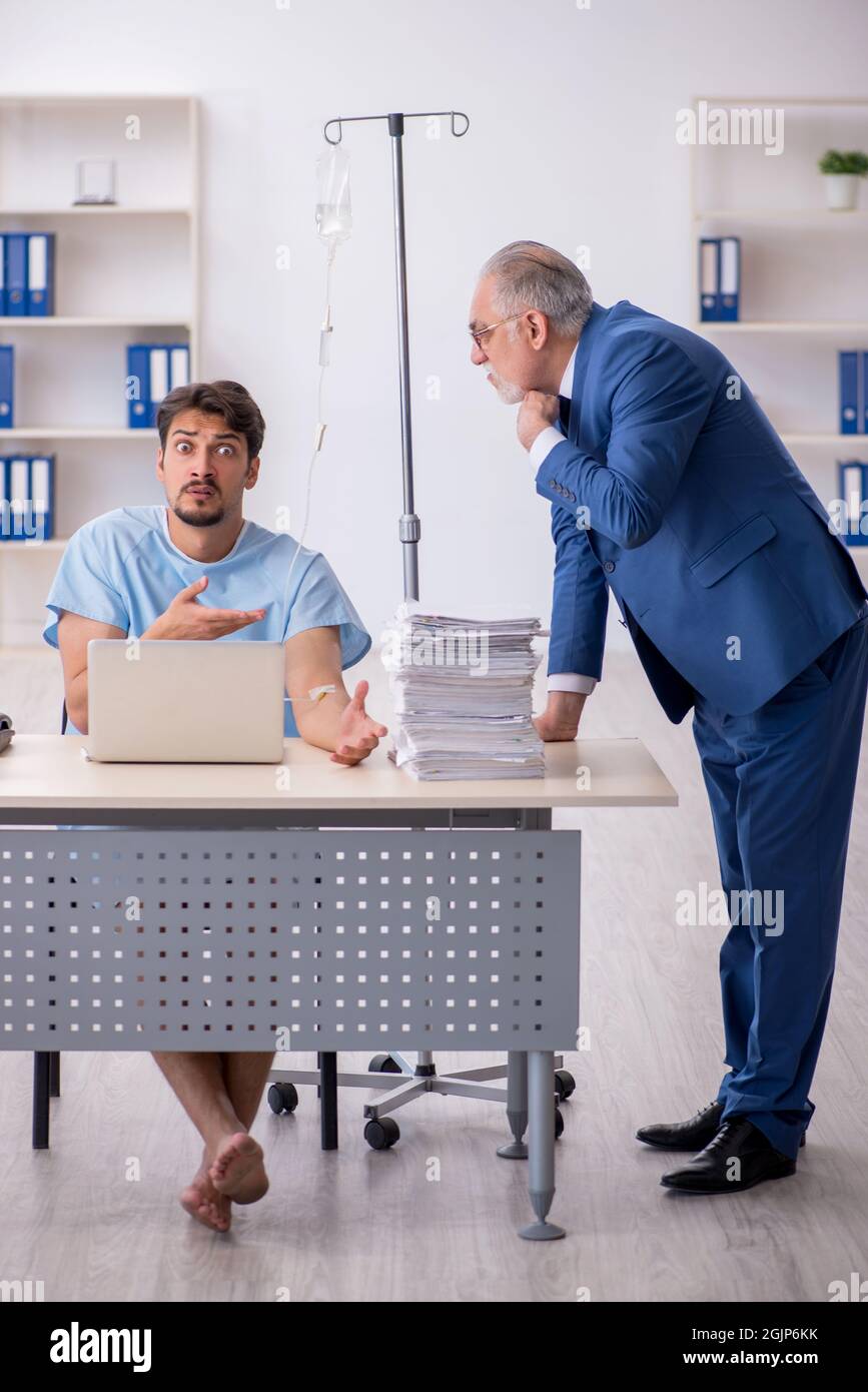 Young employee feeling bad at workplace Stock Photo - Alamy