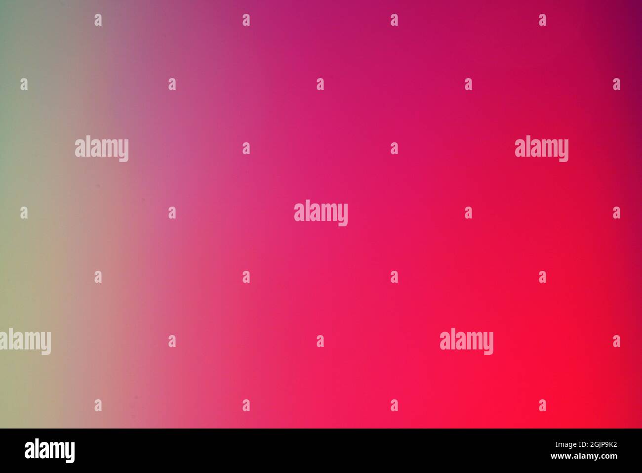 Blurry shot of a wallpaper colored with several levels of the red color ...