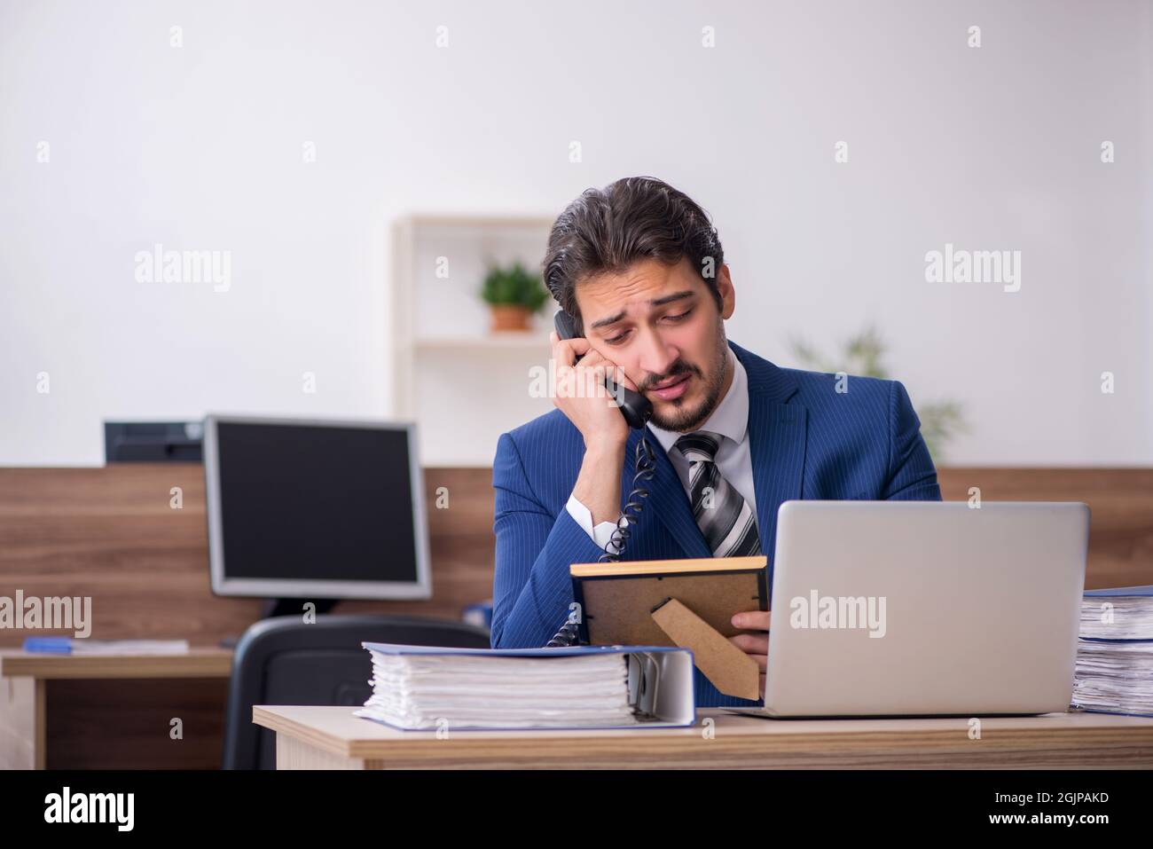 Young employee missing girlfriend at workplace Stock Photo - Alamy