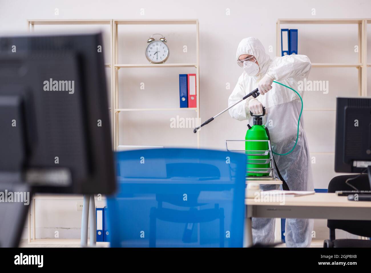 Old contractor in office disinfection concept Stock Photo - Alamy