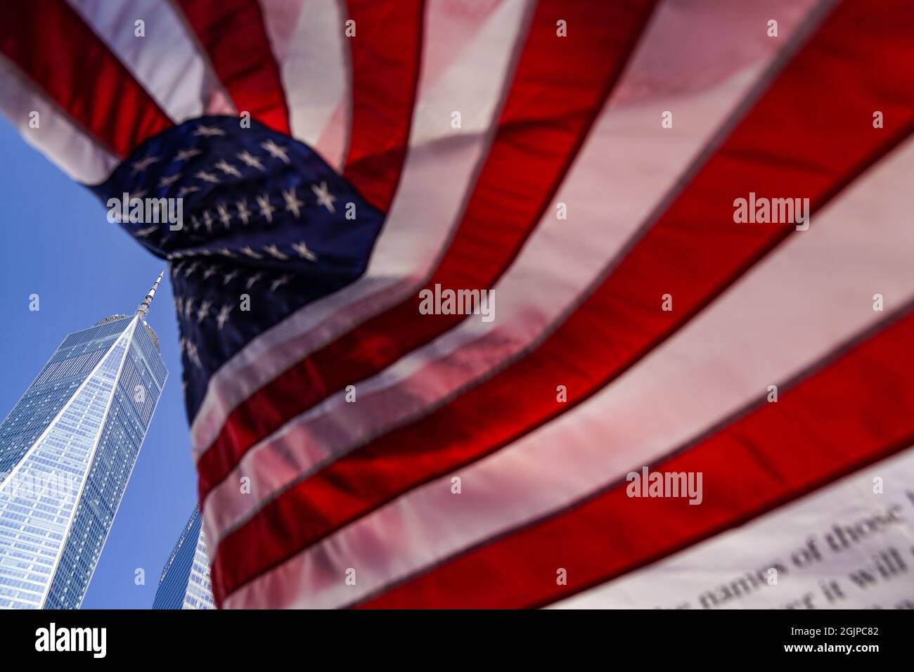 New York, USA. 11th Sep, 2021. An American flag waves in front of One ...