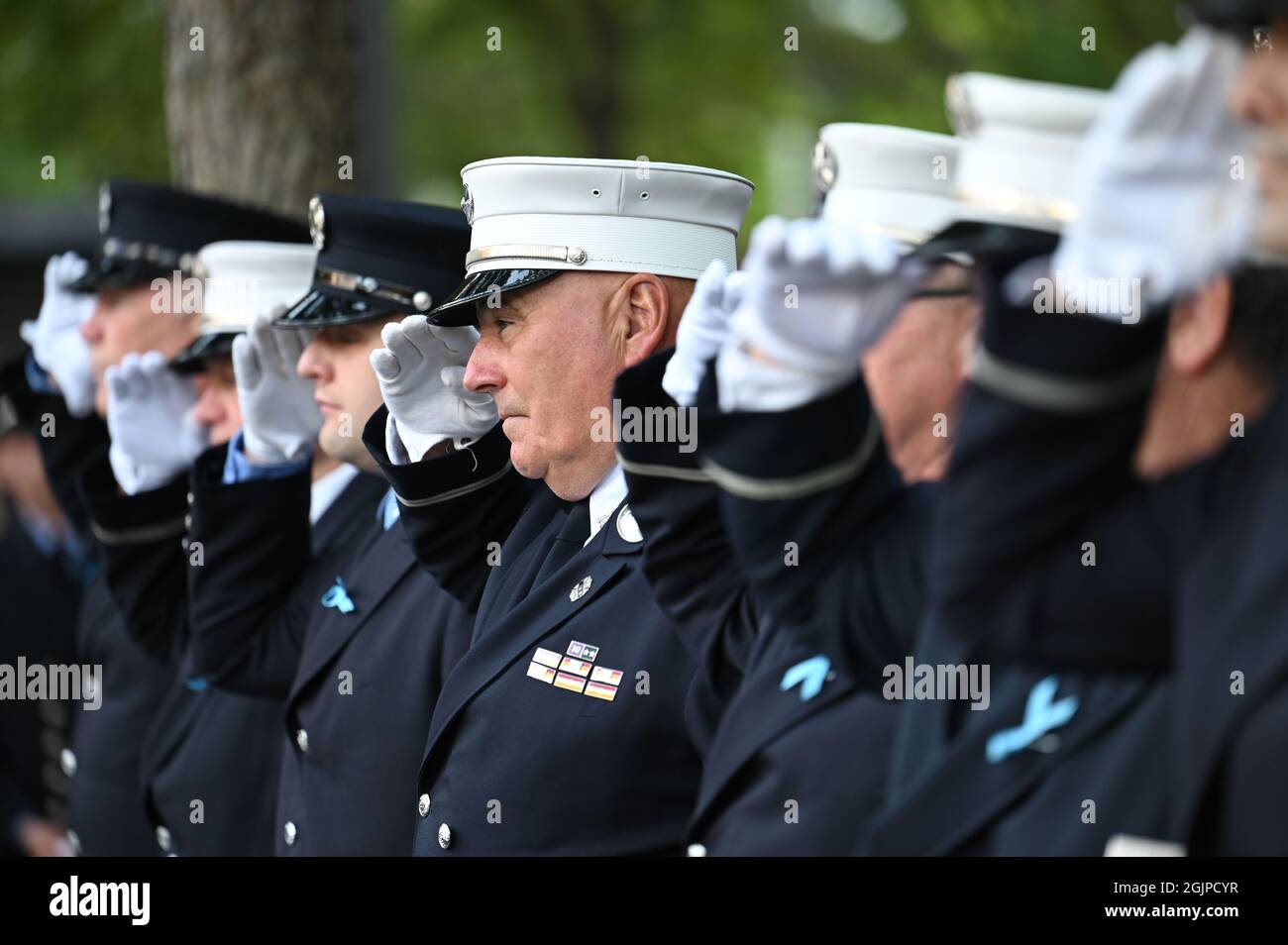 New York, USA. 11th Sep, 2021. Firefighters salute during the 20th ...