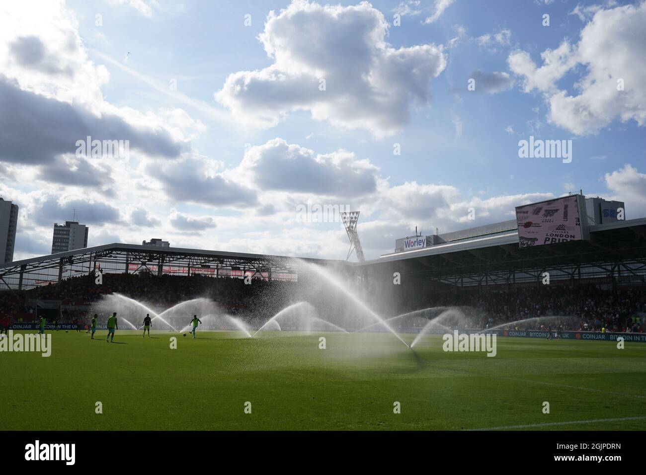 Sprinklers water the pitch at half time during the Premier League match ...