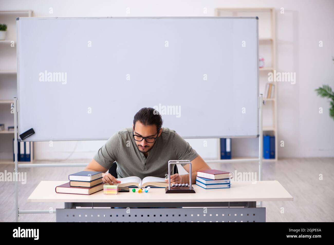 Young student preparing for exams in the classroom Stock Photo - Alamy