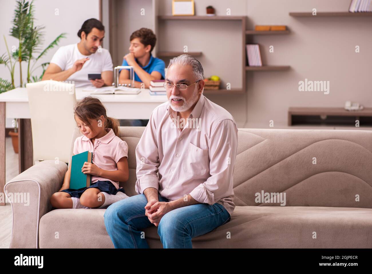 Three generations at home in early development concept Stock Photo - Alamy