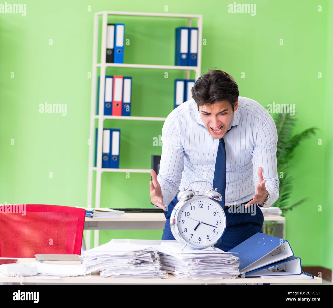 Frustrated businessman stressed from the excessive work Stock Photo - Alamy