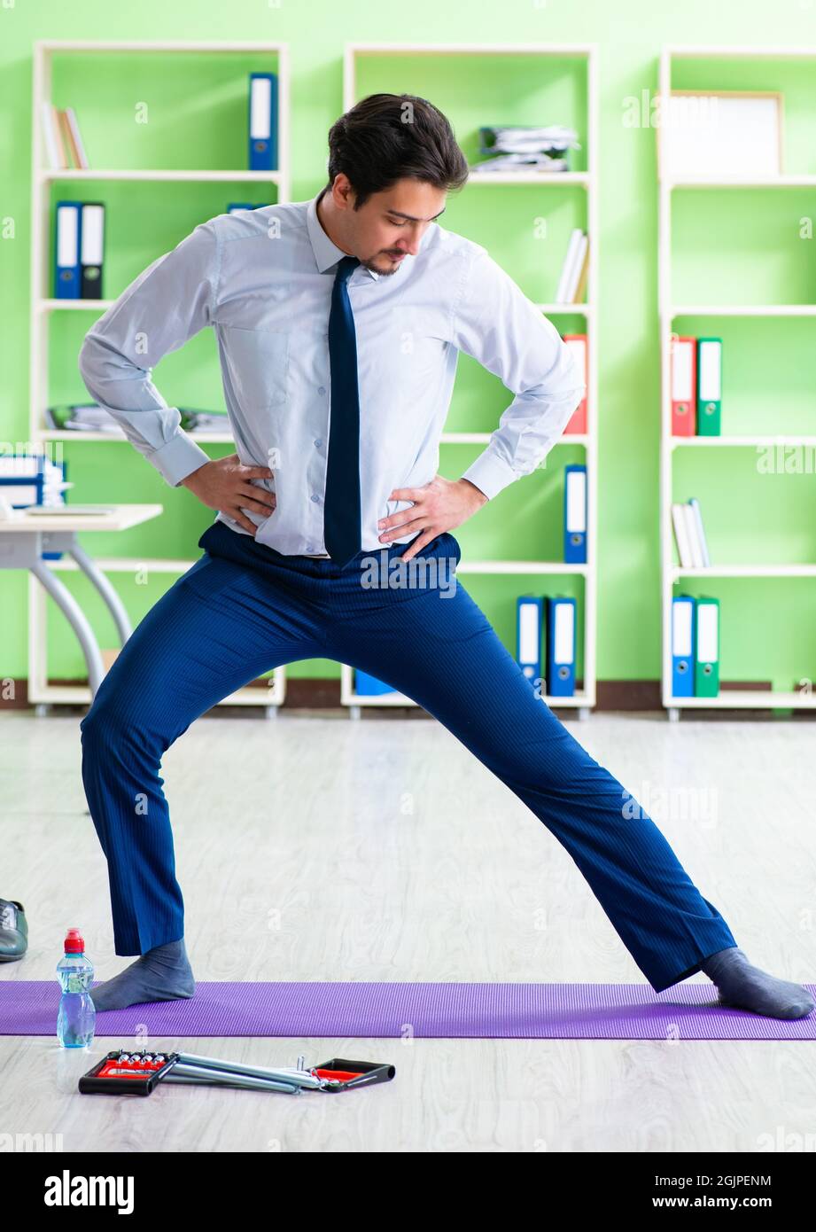 The employee doing exercises during break at work Stock Photo - Alamy