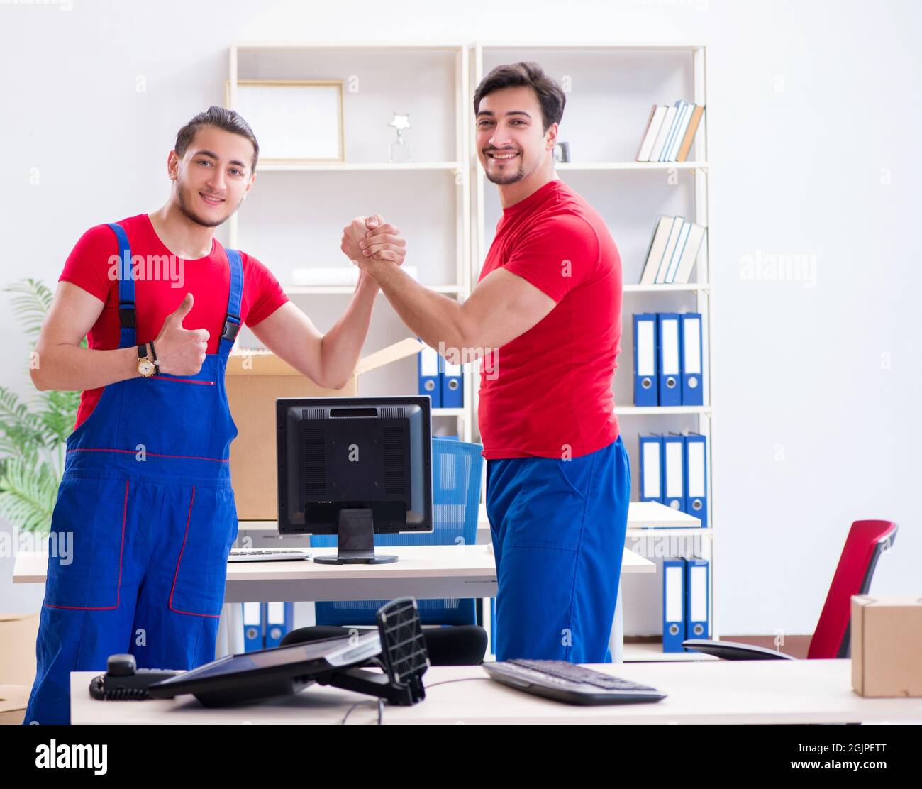 The two contractor employees moving personal belongings Stock Photo - Alamy