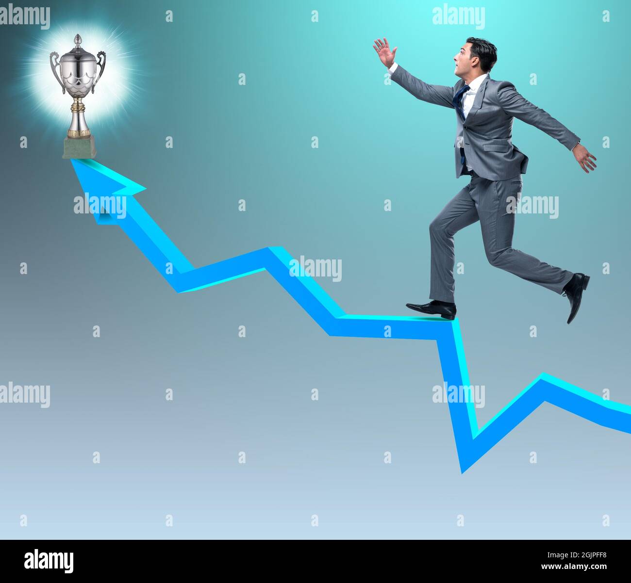 The businessman running towards prize cup trophy Stock Photo - Alamy