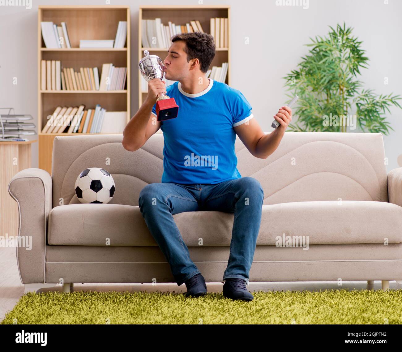 The man watching football at home Stock Photo - Alamy