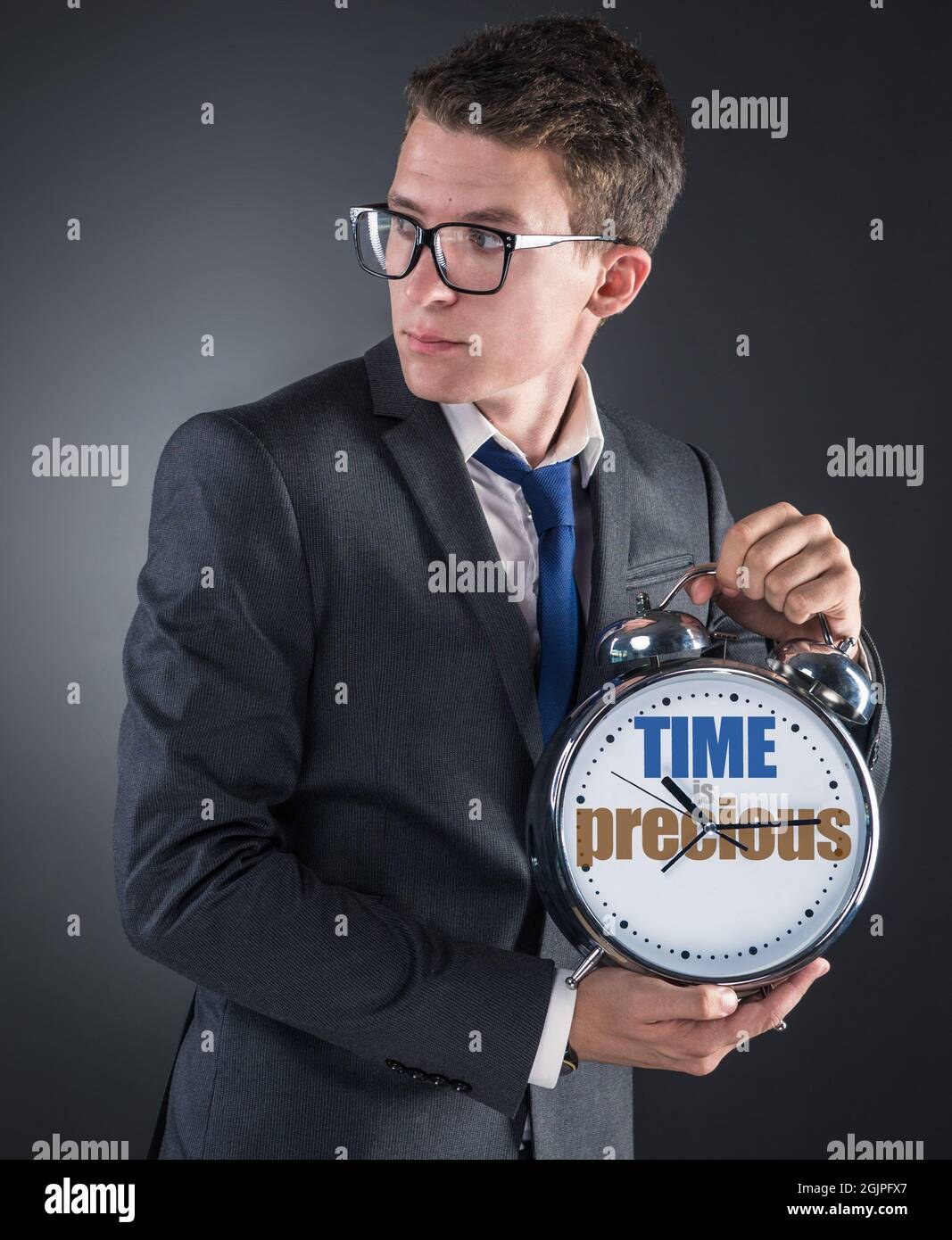 The young businessman time importance concept Stock Photo - Alamy