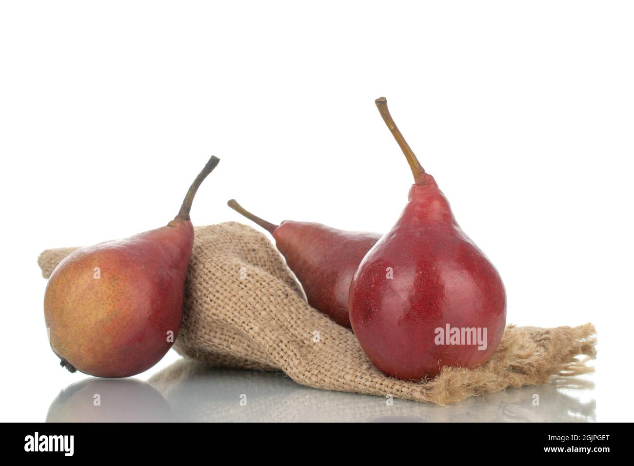 Three ripe red pears with a jute bag, close-up, isolated on white Stock ...