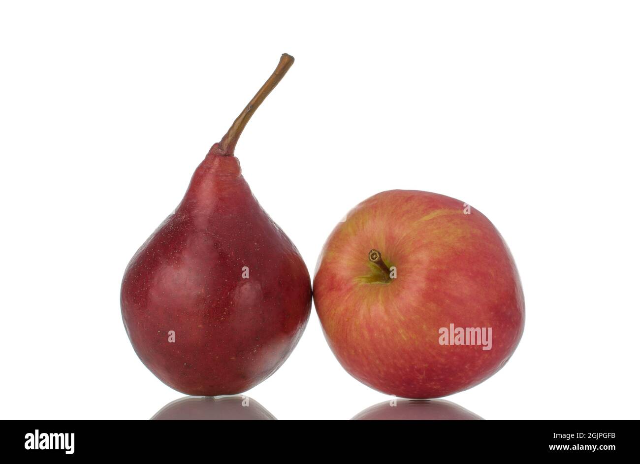 One red pear and apple, close-up, isolated on white Stock Photo - Alamy