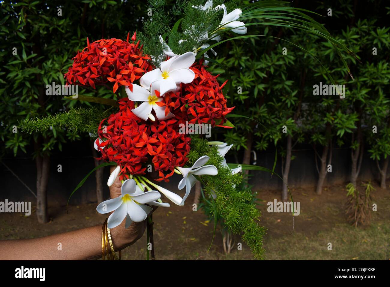 Female holding giving or receiving a beautiful bunch of flower bouquet ...