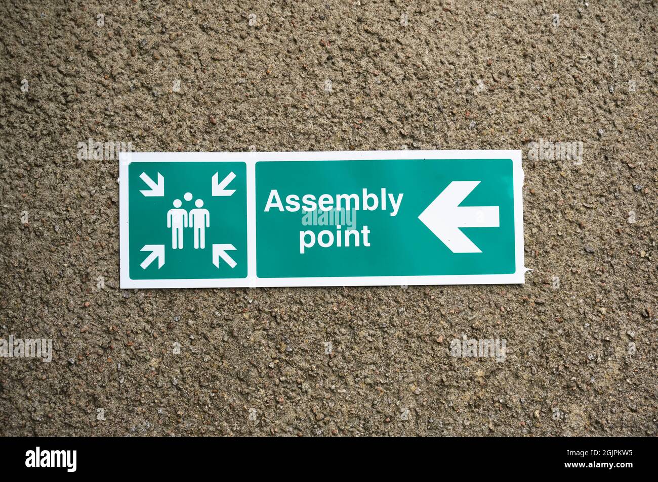 Fire assembly point sign at workplace signpost Stock Photo - Alamy