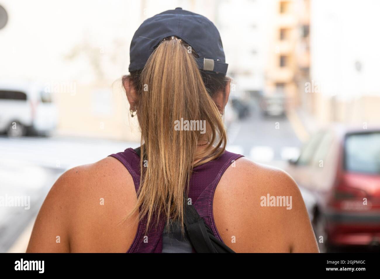 Back view of a caucasian female doing sport outdoors Stock Photo - Alamy