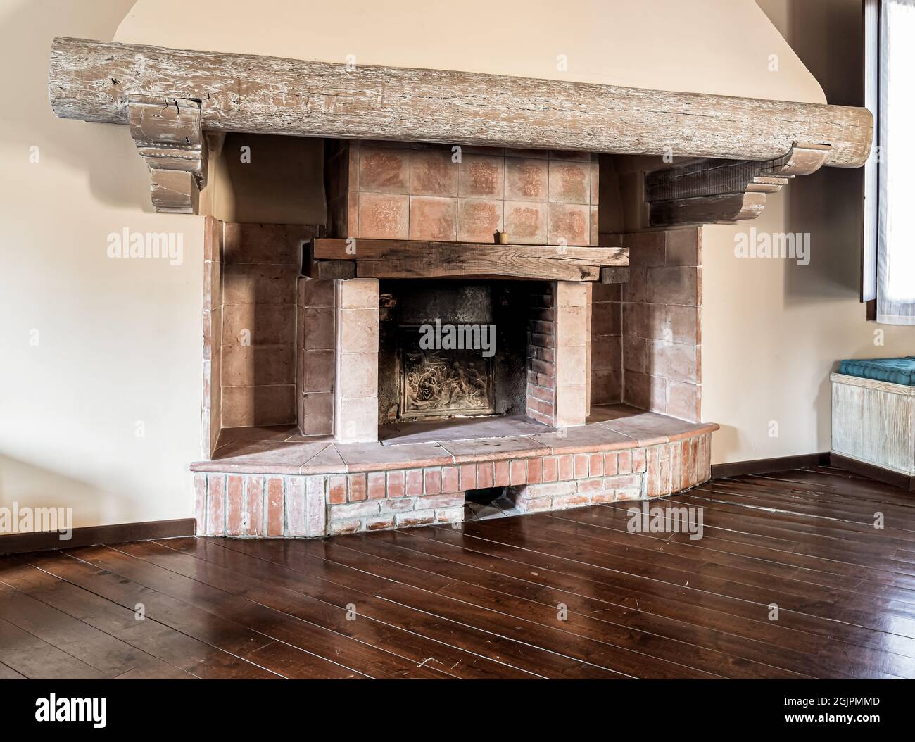 Rustic brick fireplace with antique wooden beam inside the house ...